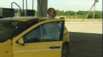 Putin drives Lada along new Siberian highway
