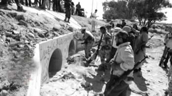 Pulled from drain pipe, Gaddafi shown no mercy